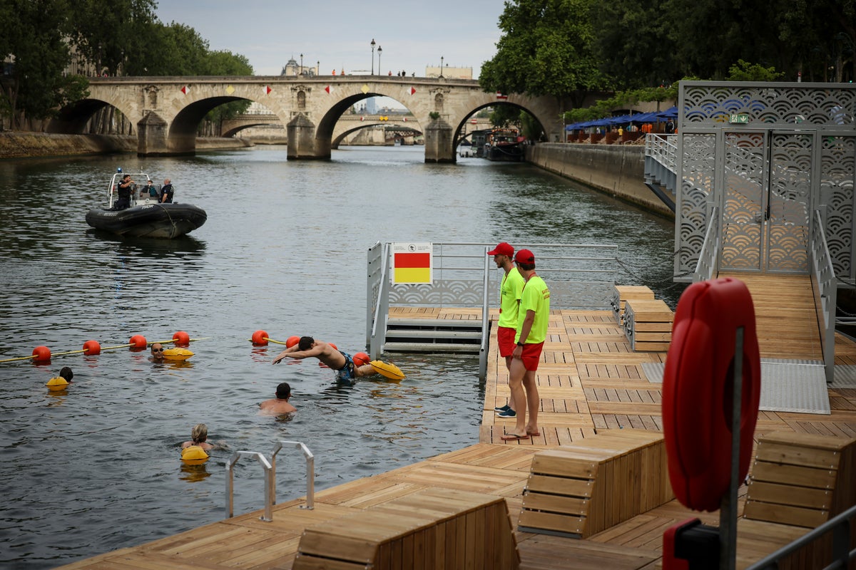 In pictures: Swimmers plunge into the river Seine after 100-year ban ...