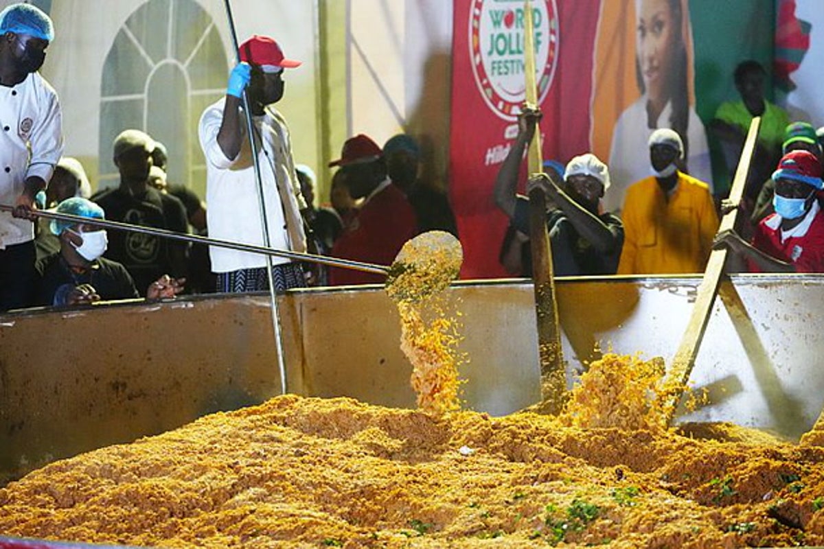 Nigerian chef breaks jollof rice world record with 8,780kg dish ...