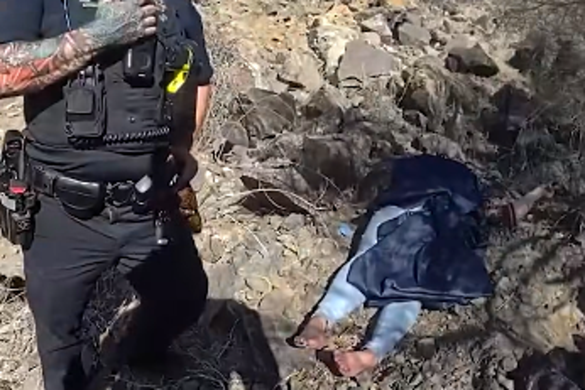 Moment cops rescue a distressed hiker who had spent day stranded on ...